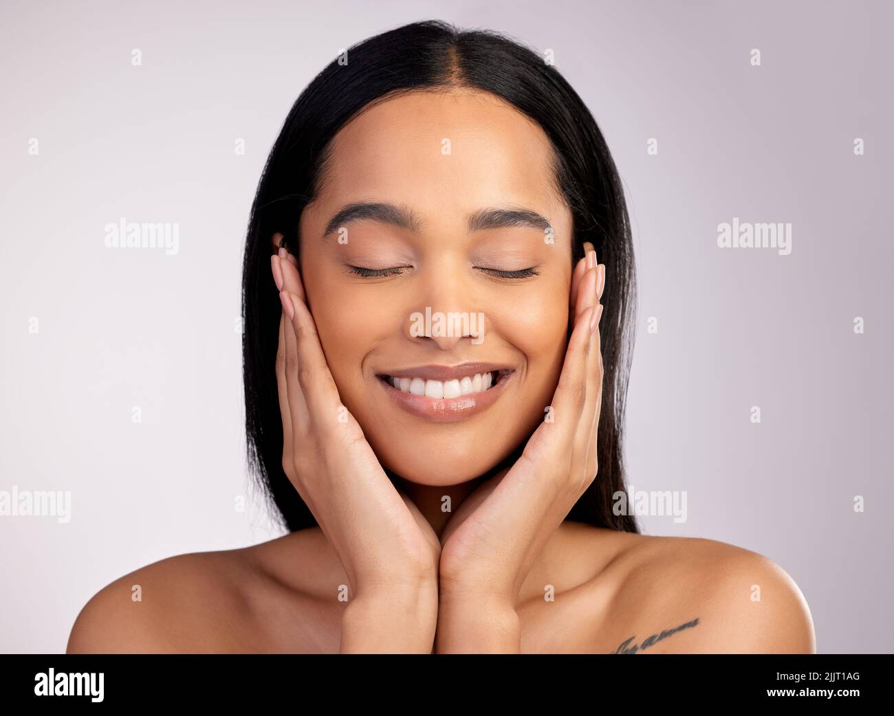 Keeping her hands to herself. an attractive young woman touching her ...