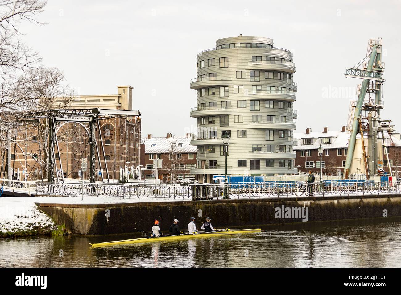 Rowing team in Leidsche Rijn canal near Muntsluisbrug with modern ...