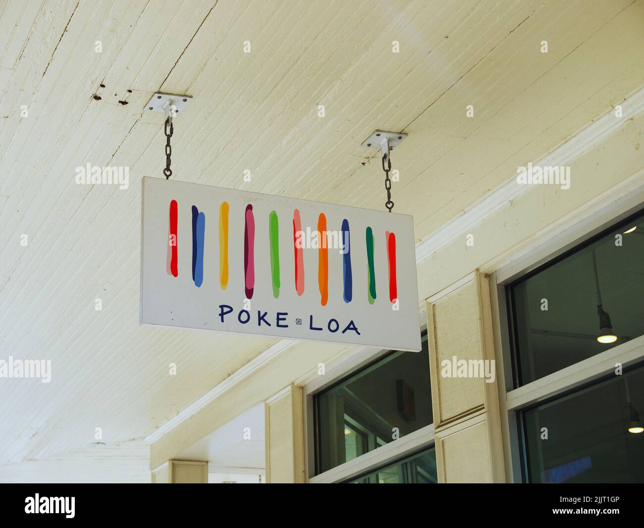 A low angle shot of Poke Loa sign hanging on the ceiling chain of poke ...