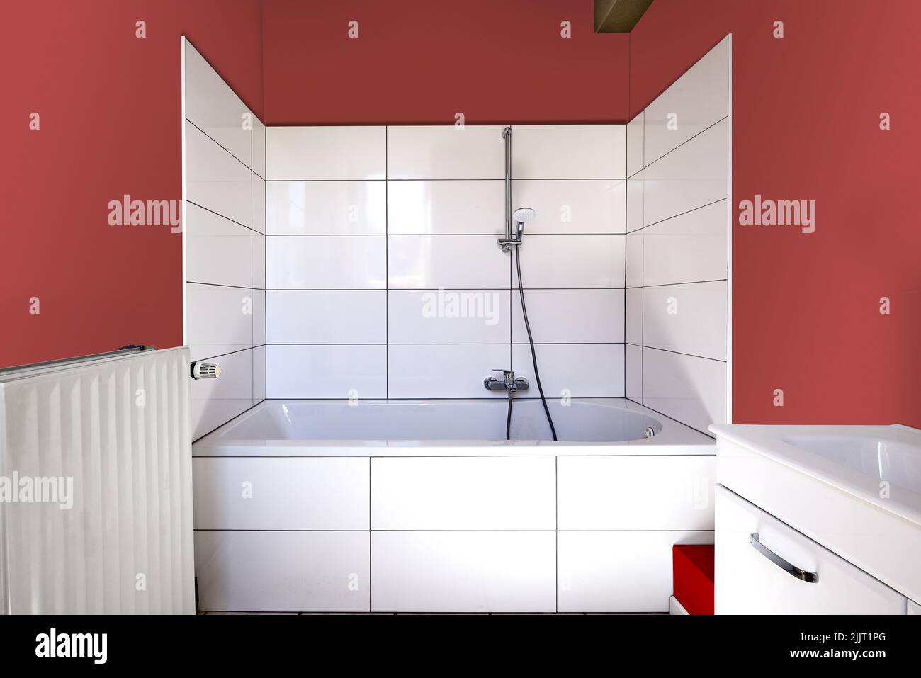 Renovated bathroom with white tiles and new sink Stock Photo - Alamy