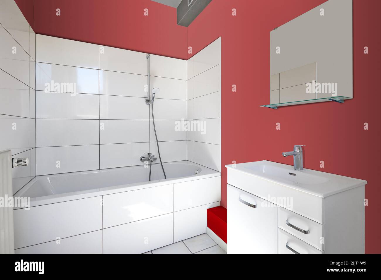 Renovated bathroom with white tiles and new sink Stock Photo - Alamy