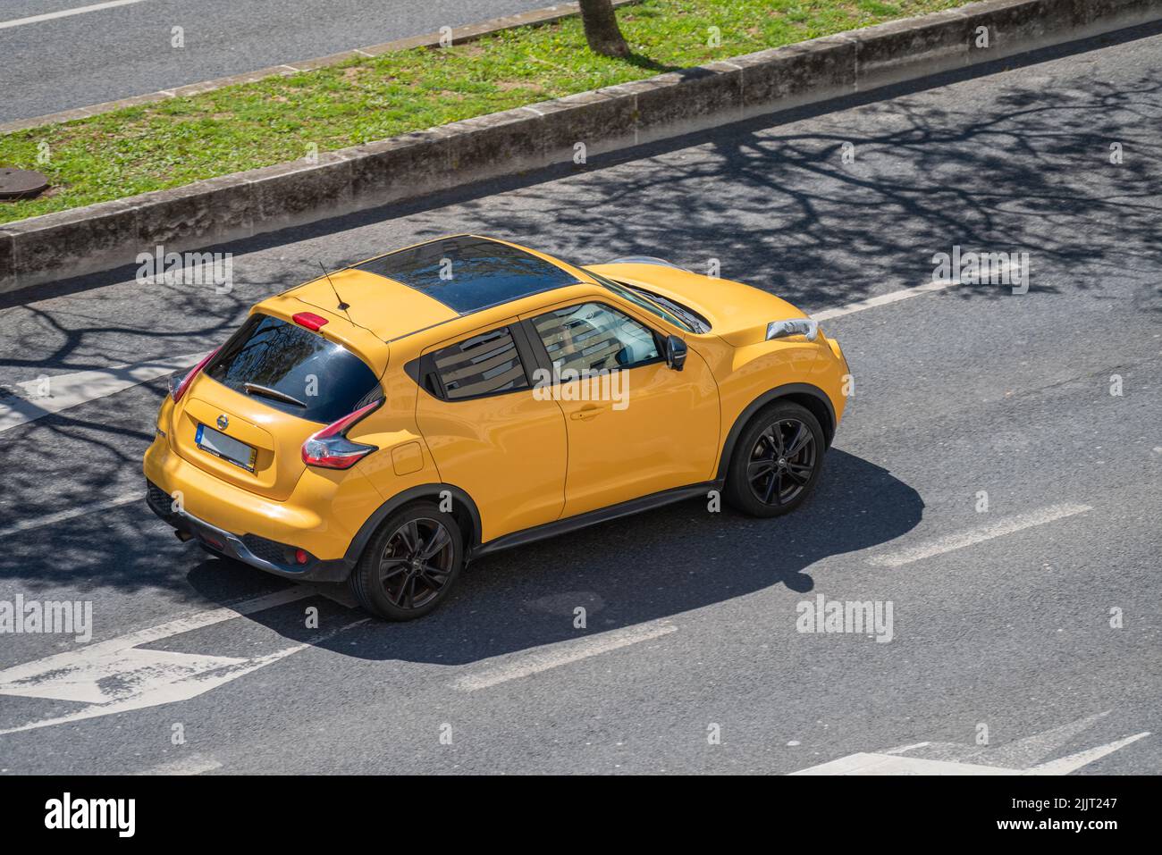 A photo of a yellow Nissan Juke SUV Coupe car on the streets of Lisbon ...