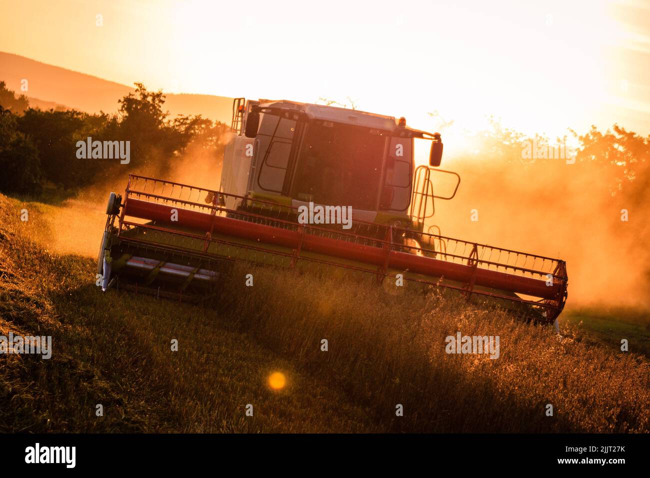 A Combine harvester harvesting on a field in Bad Homburg, Germany Stock ...