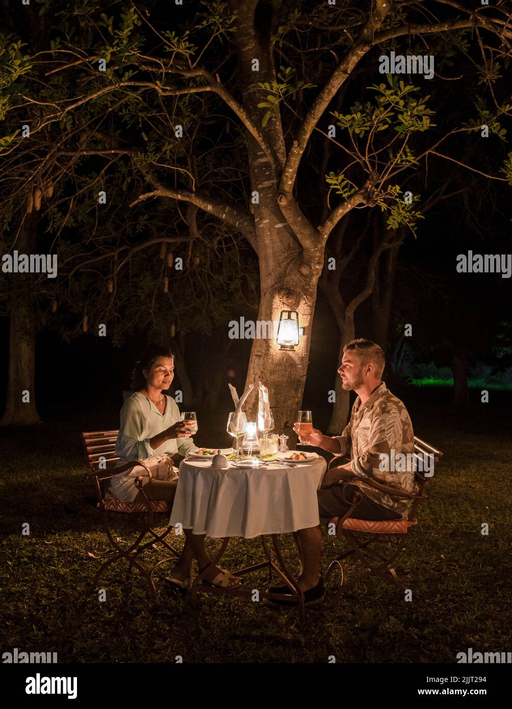 couple on safari in South Africa, Asian women and European men having a ...