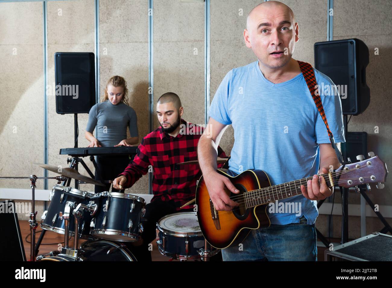 Male soloist singing with band Stock Photo - Alamy