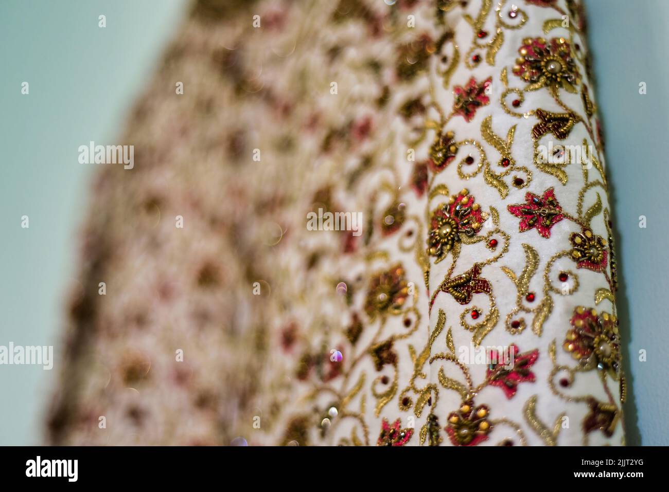 A closeup of Indian traditional cloth that the groom wears on the ...