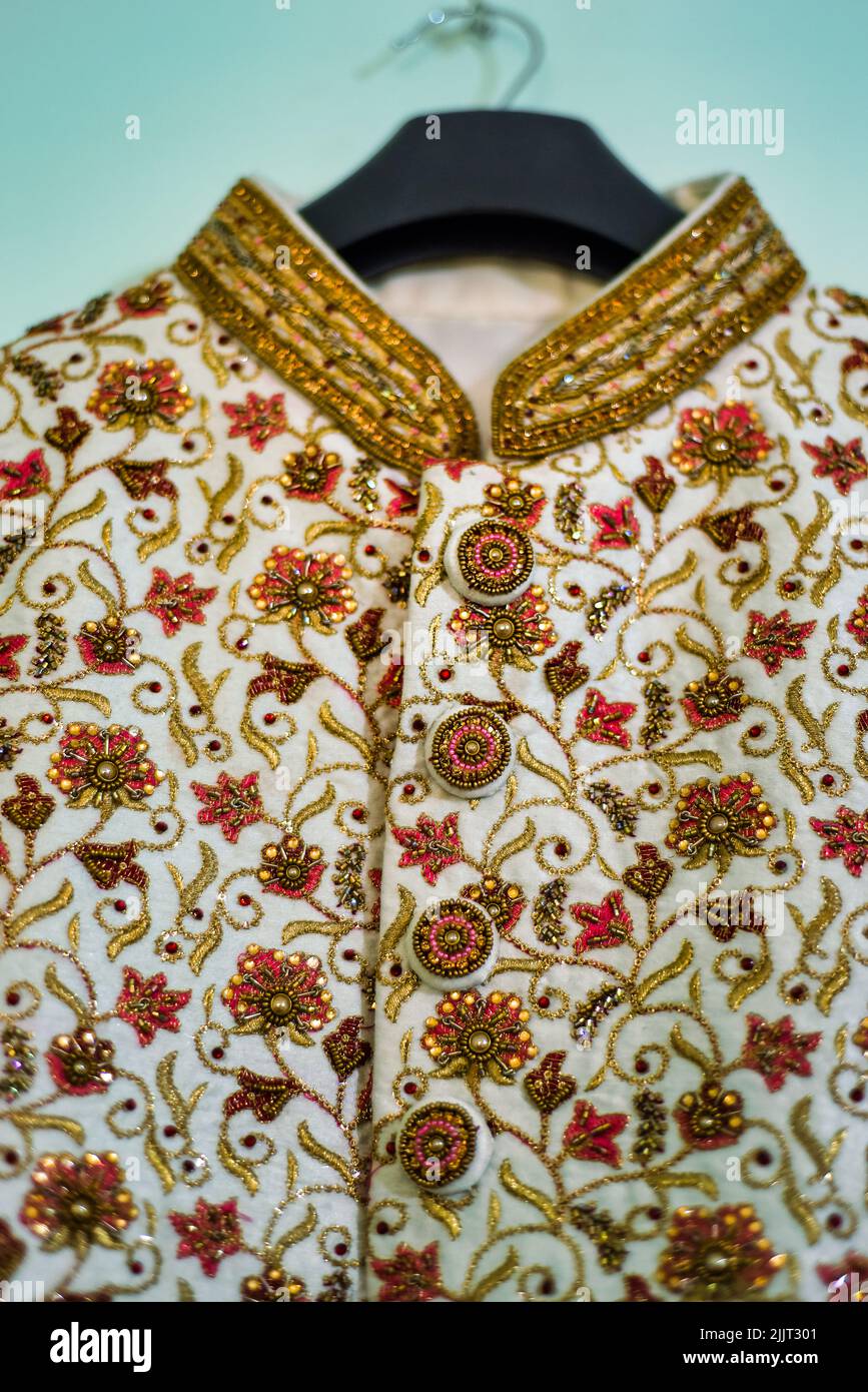 A closeup of Indian traditional cloth that the groom wears on the ...