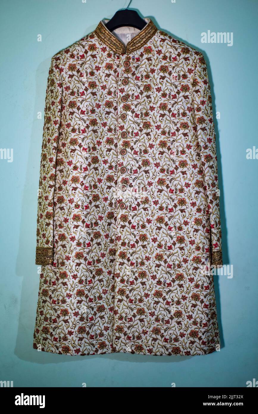 A closeup of Indian traditional cloth that the groom wears on the ...