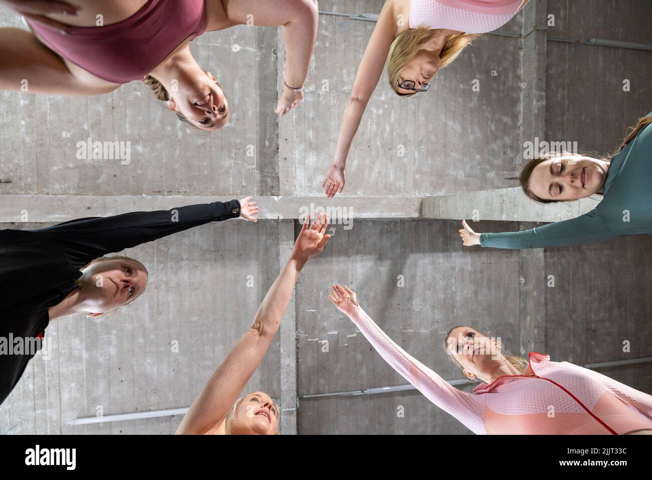Group of six young motivated sporty girls wearing sports attire ...