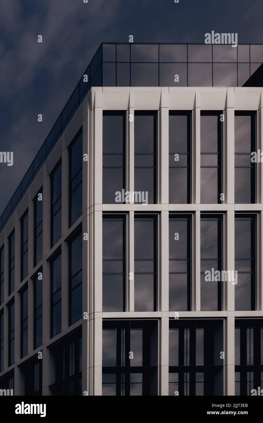 A vertical shot of a modern style grey office building in Ireland Stock ...