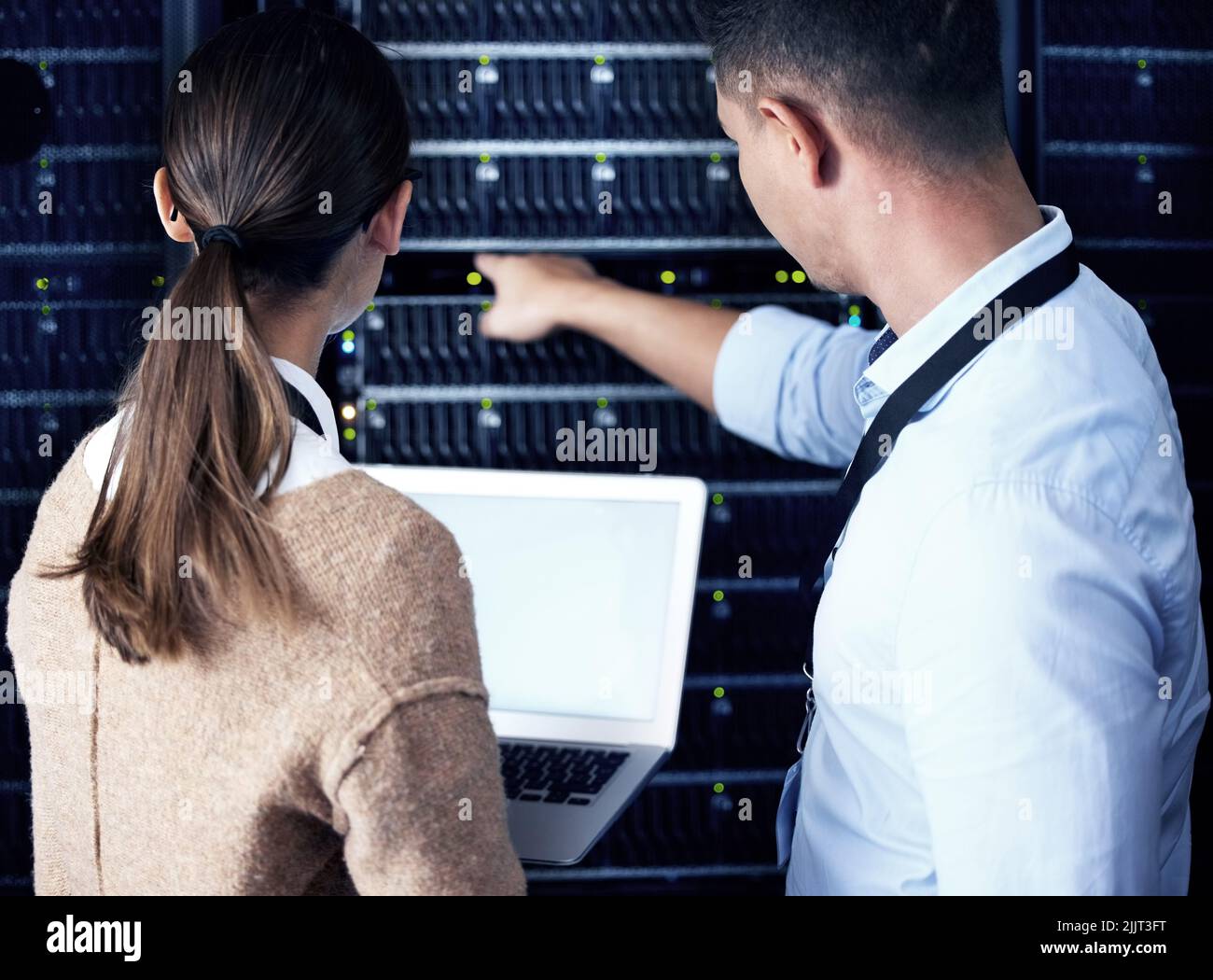Two male female technicians stand hi-res stock photography and images - Alamy