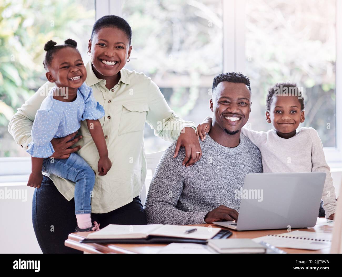 Love your family as you love yourself. a happy young family huddled ...