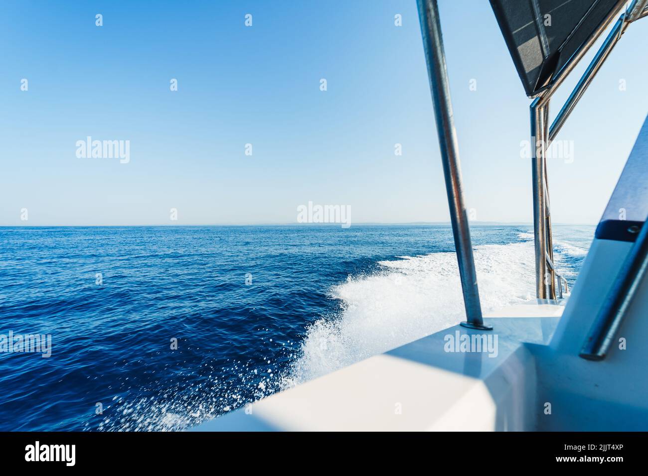 A beautiful seascape from a cruise boat under a blue sky Stock Photo ...
