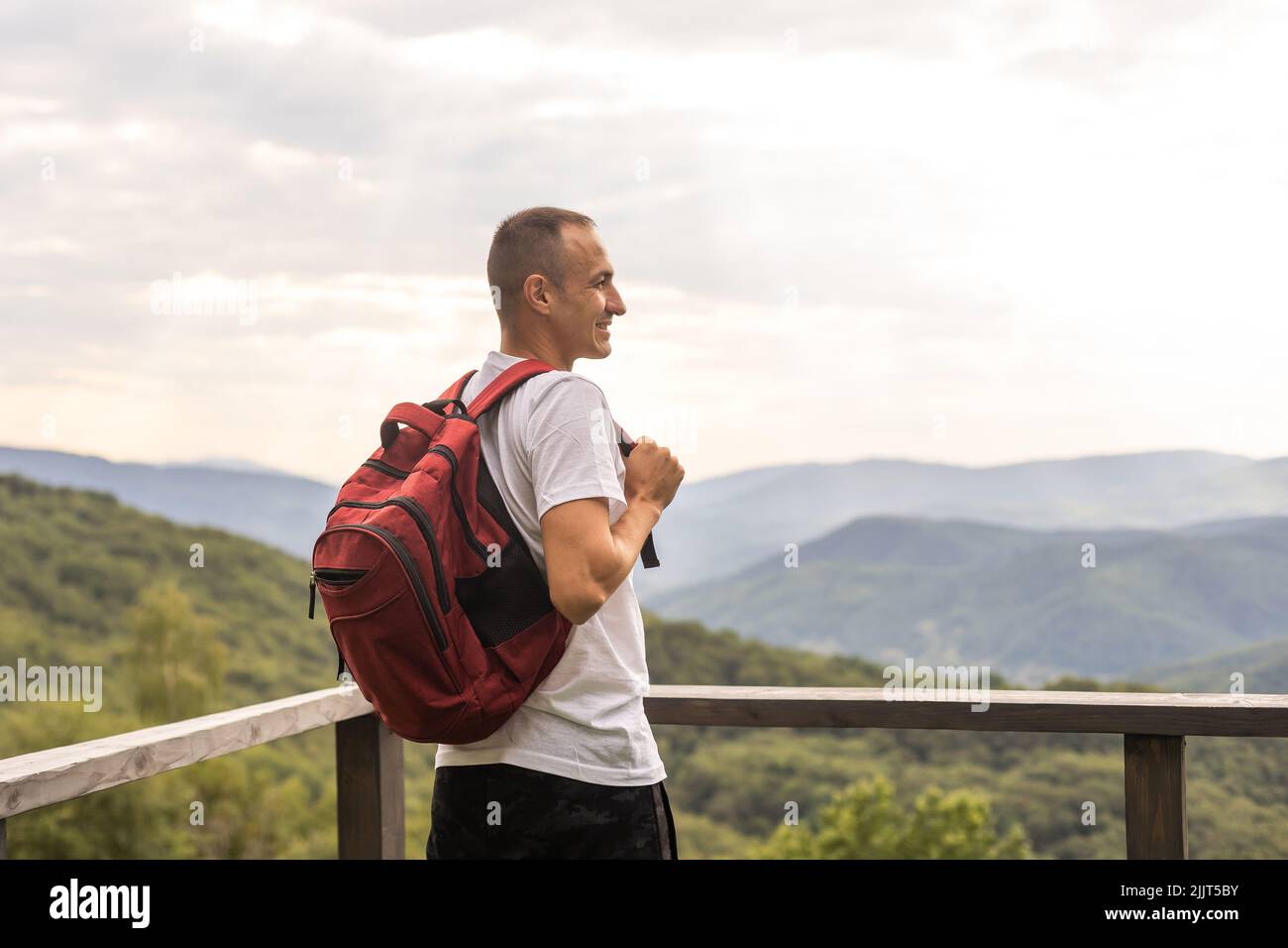 Hiker cheering elated and blissful after hiking Stock Photo - Alamy