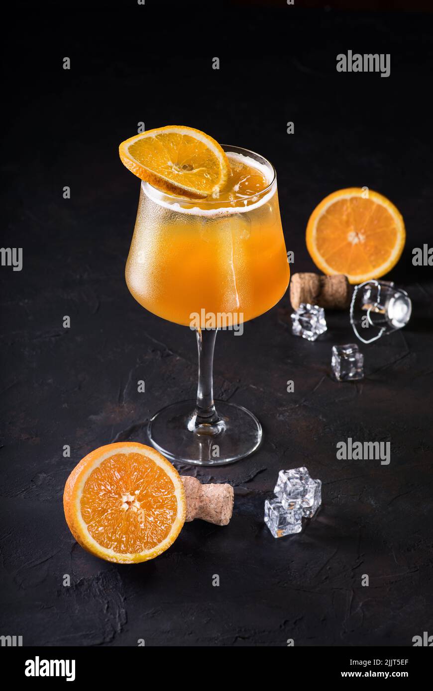 Mimosa cocktail in a champagne glass with orange juice and sparkling ...