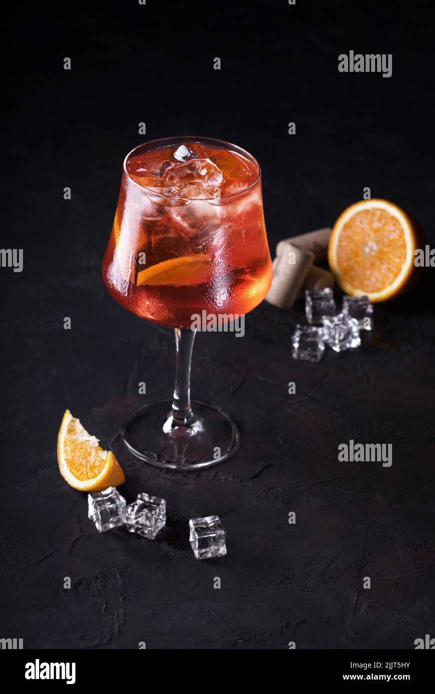 Stylish alcoholic pink aperol spritz,trendy cocktail with orange slice ...