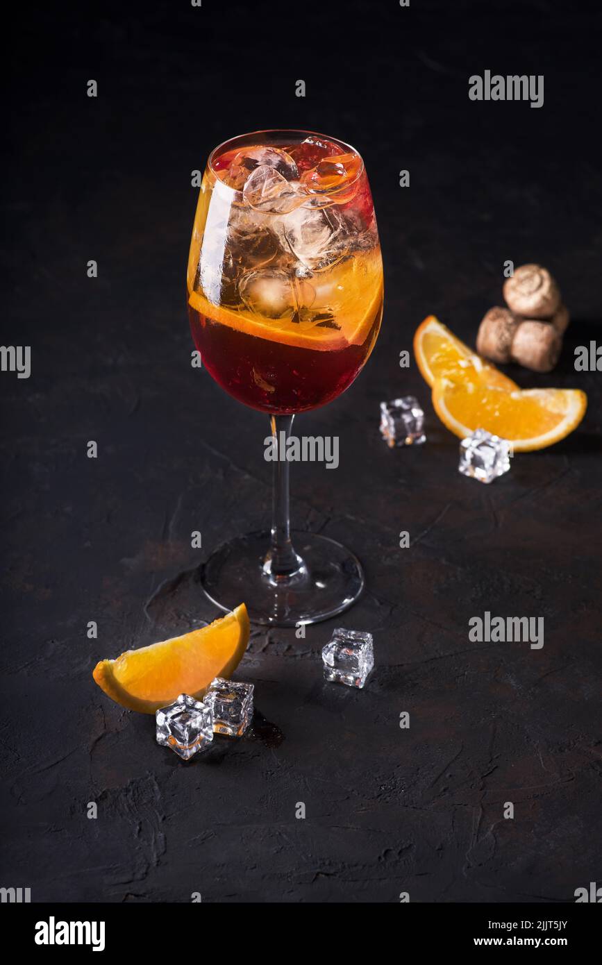 Stylish alcoholic aperol spritz trendy cocktail with orange slice on ...