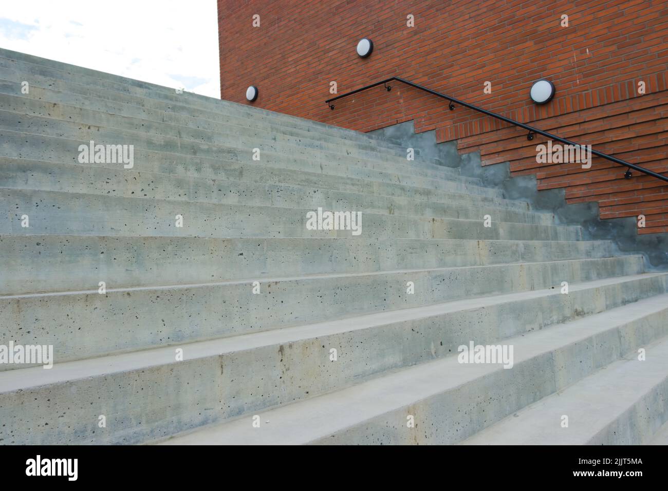 Concrete stairs by modern brick building Stock Photo - Alamy