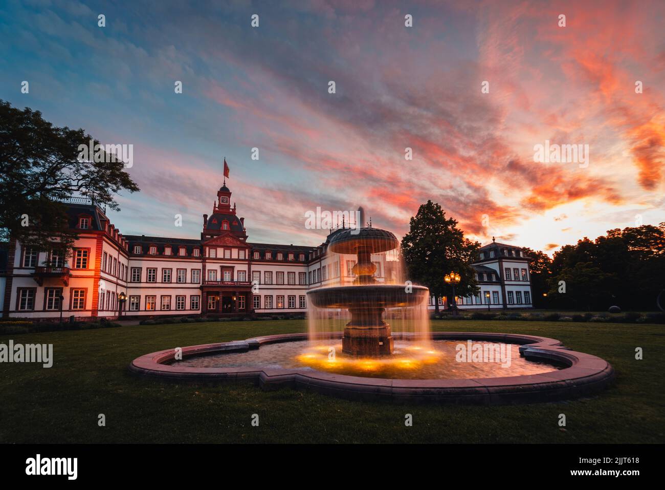 The Schloss Philippsruhe castle at sunset in Hanau, Germany Stock Photo ...