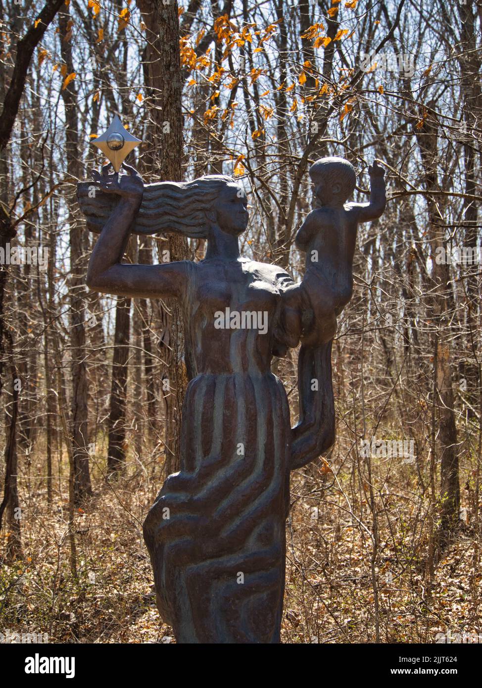 A vertical shot of statues at the Overland Park Arboretum, United ...