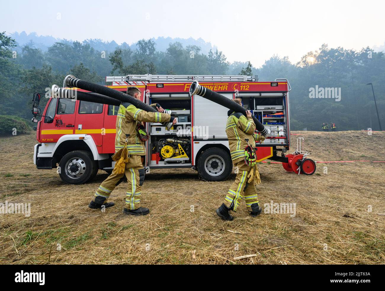Schmilka, Germany. 28th July, 2022. Firefighters work on the banks of ...