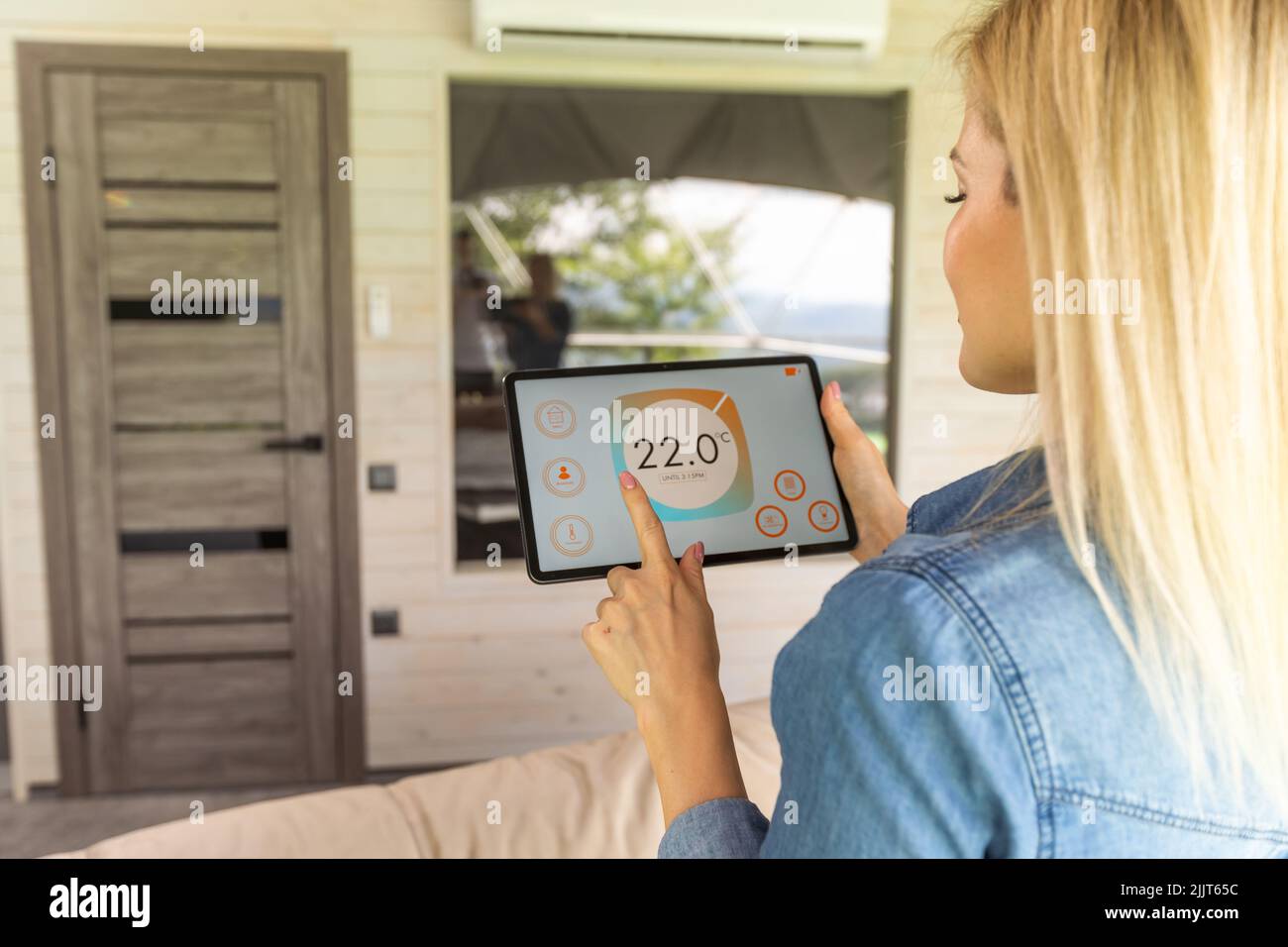 Modern home smart automation app on tablet display in woman hands Stock ...