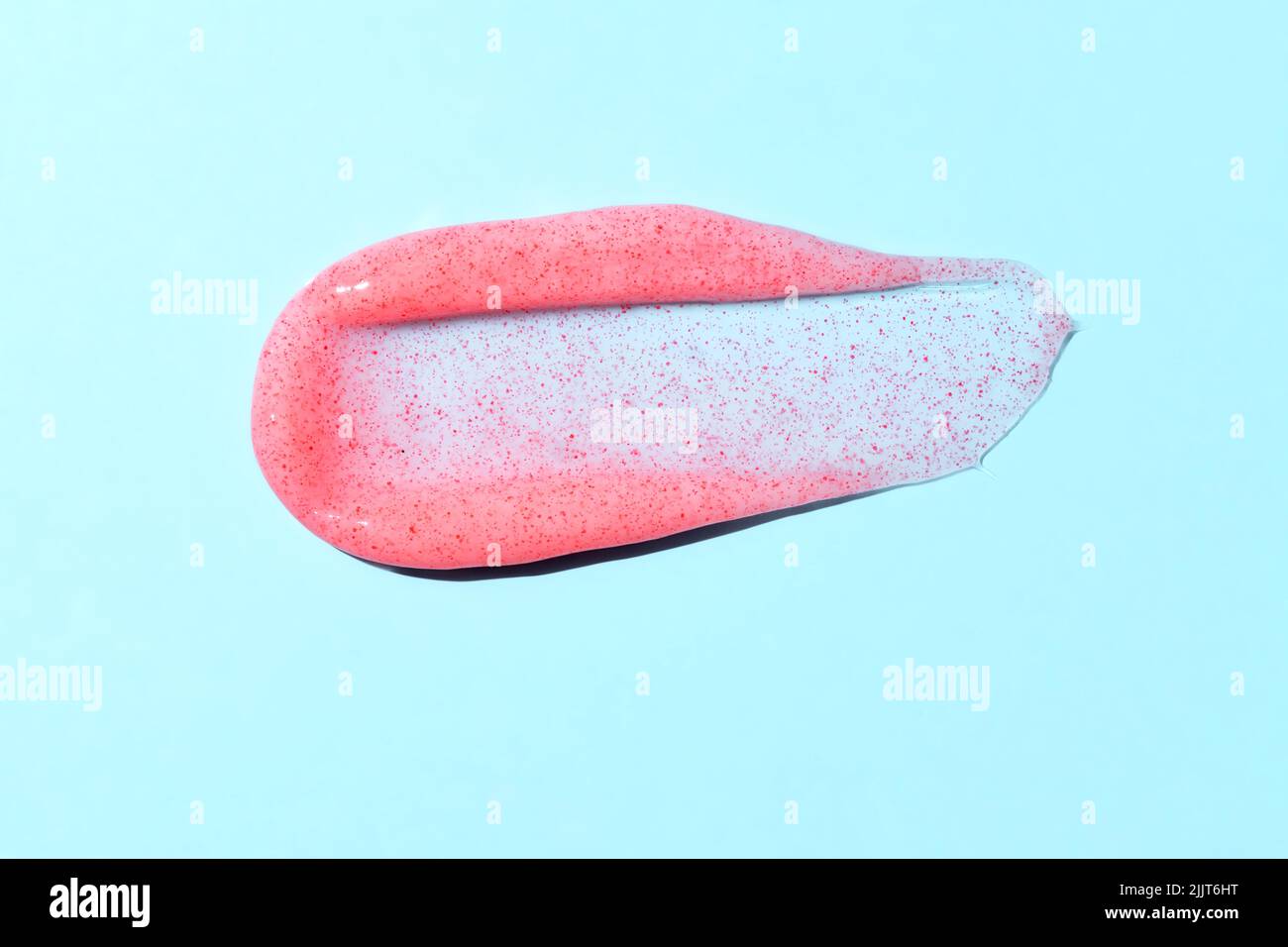 Scrub smear on blue background. Texture cosmetic scrub for face and ...