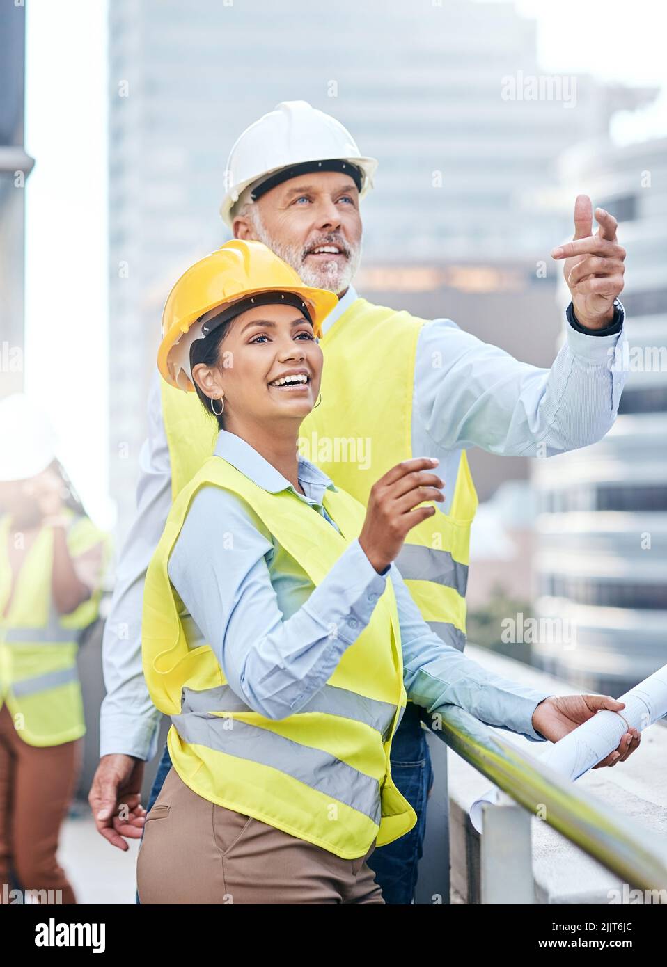 The build of their dreams. two businesspeople working together at a ...