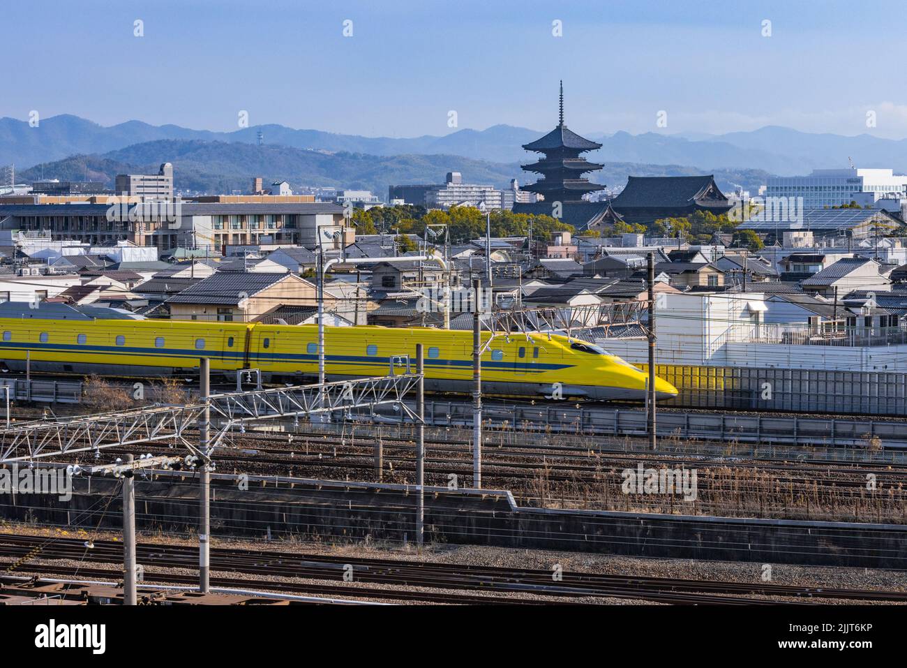 A motion view of yellow bullet train Shinkansen in background of ...