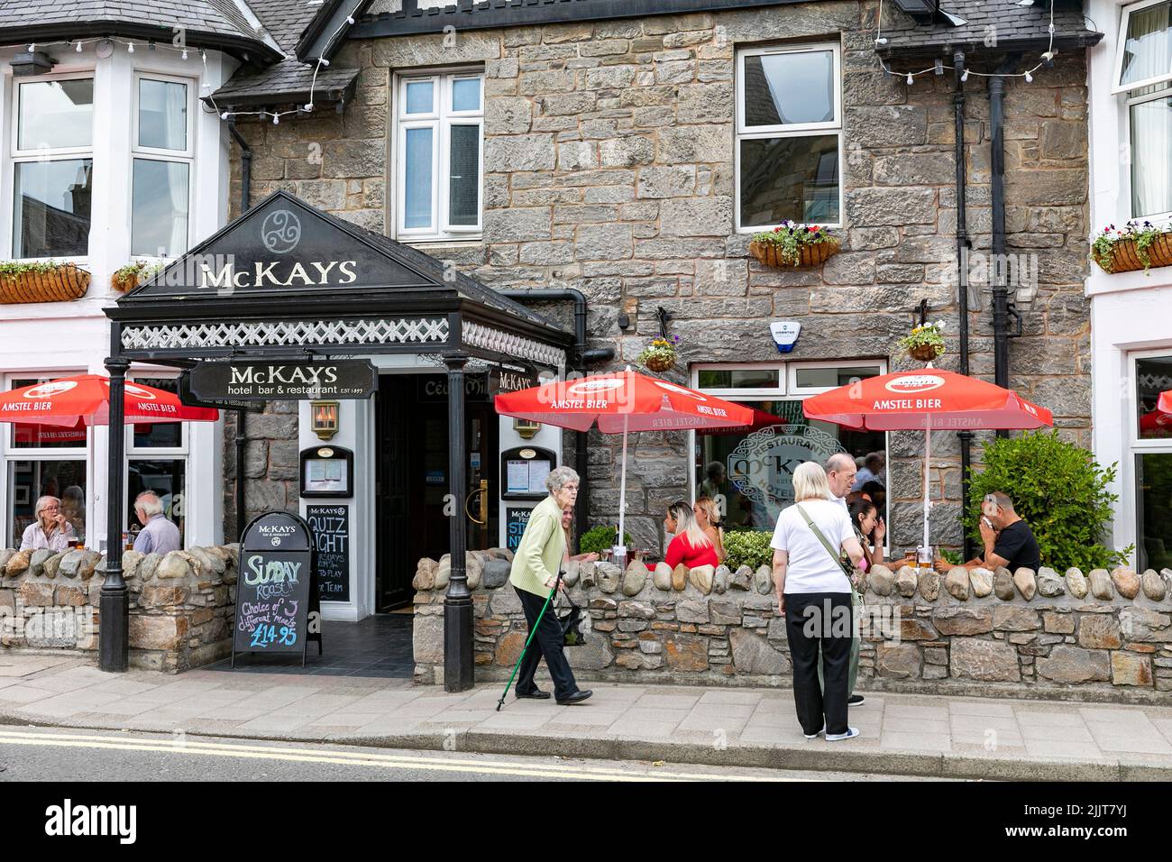 Pitlochry town centre in Perthshire Scotland with people dining at ...