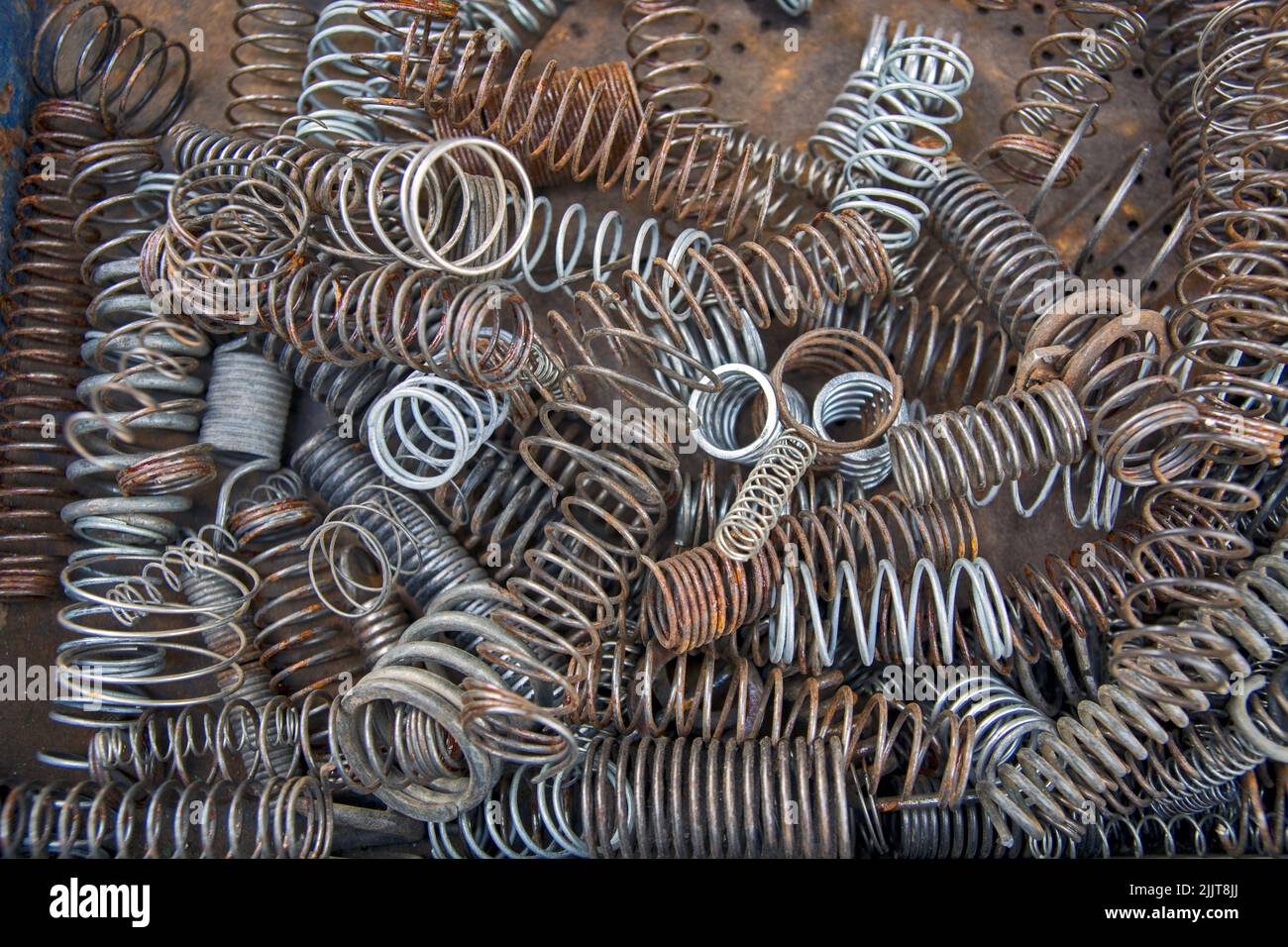 A pile of rusty scrap metal springs ready to be sold Stock Photo - Alamy