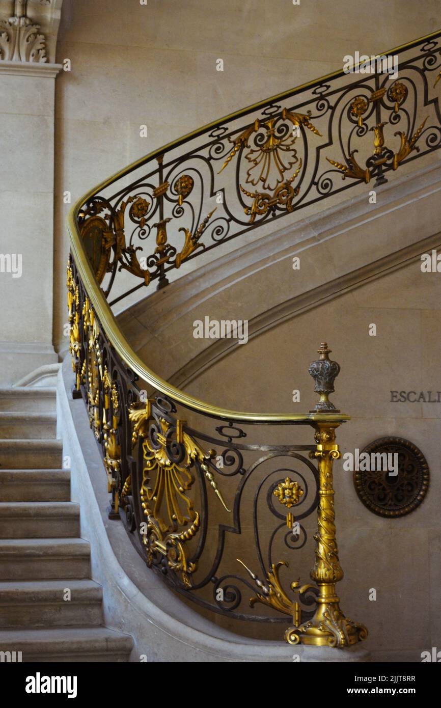 A view of the golden staircase banister in museum in Paris, France ...
