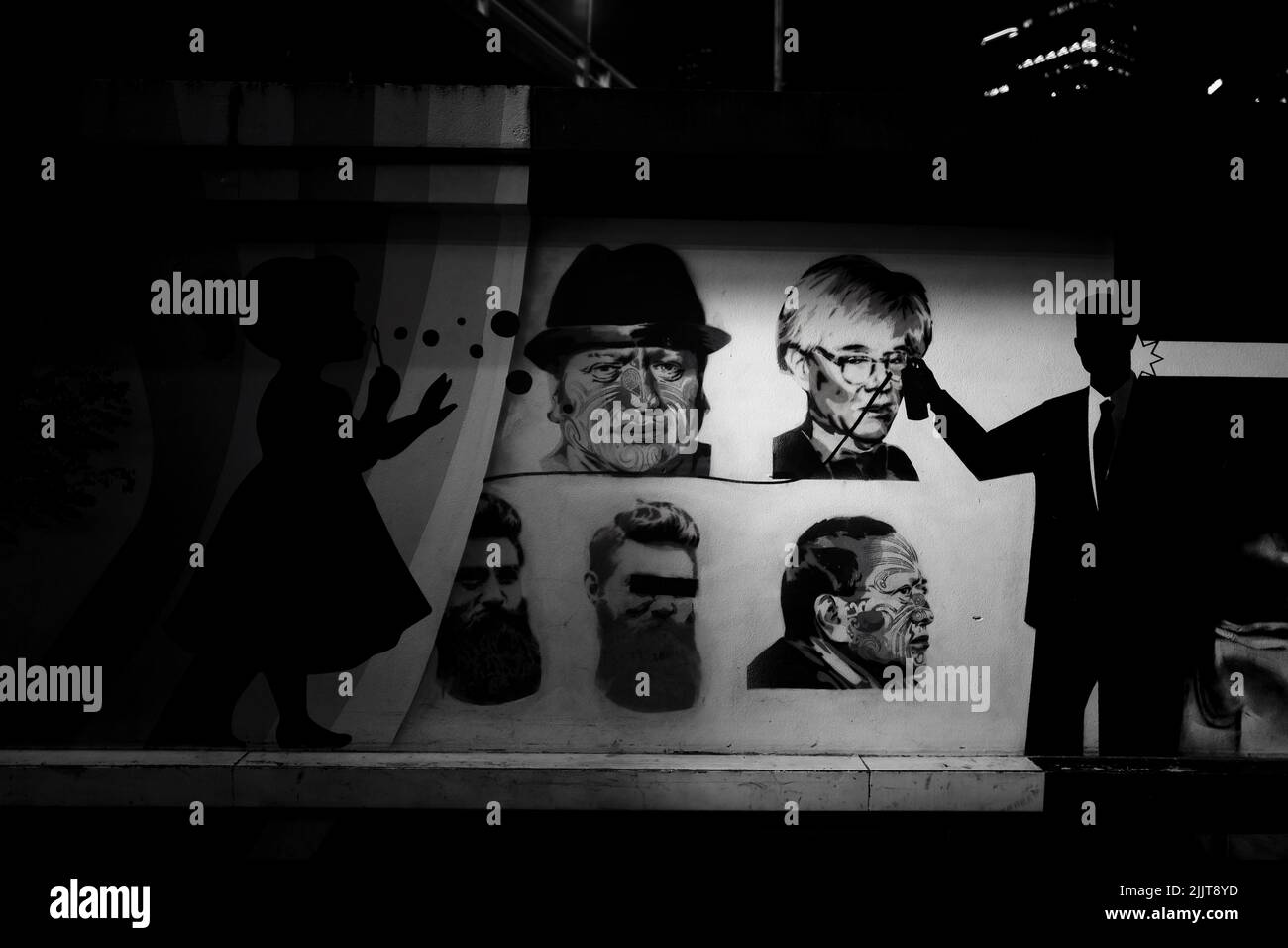 A grayscale shot of street art of faces in Southbank, Melbourne Stock ...