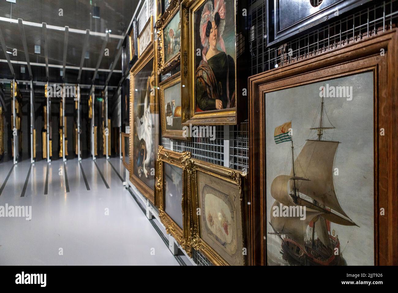 Art pieces hanging on grids in Boijmans van Beuningen artwork depot ...