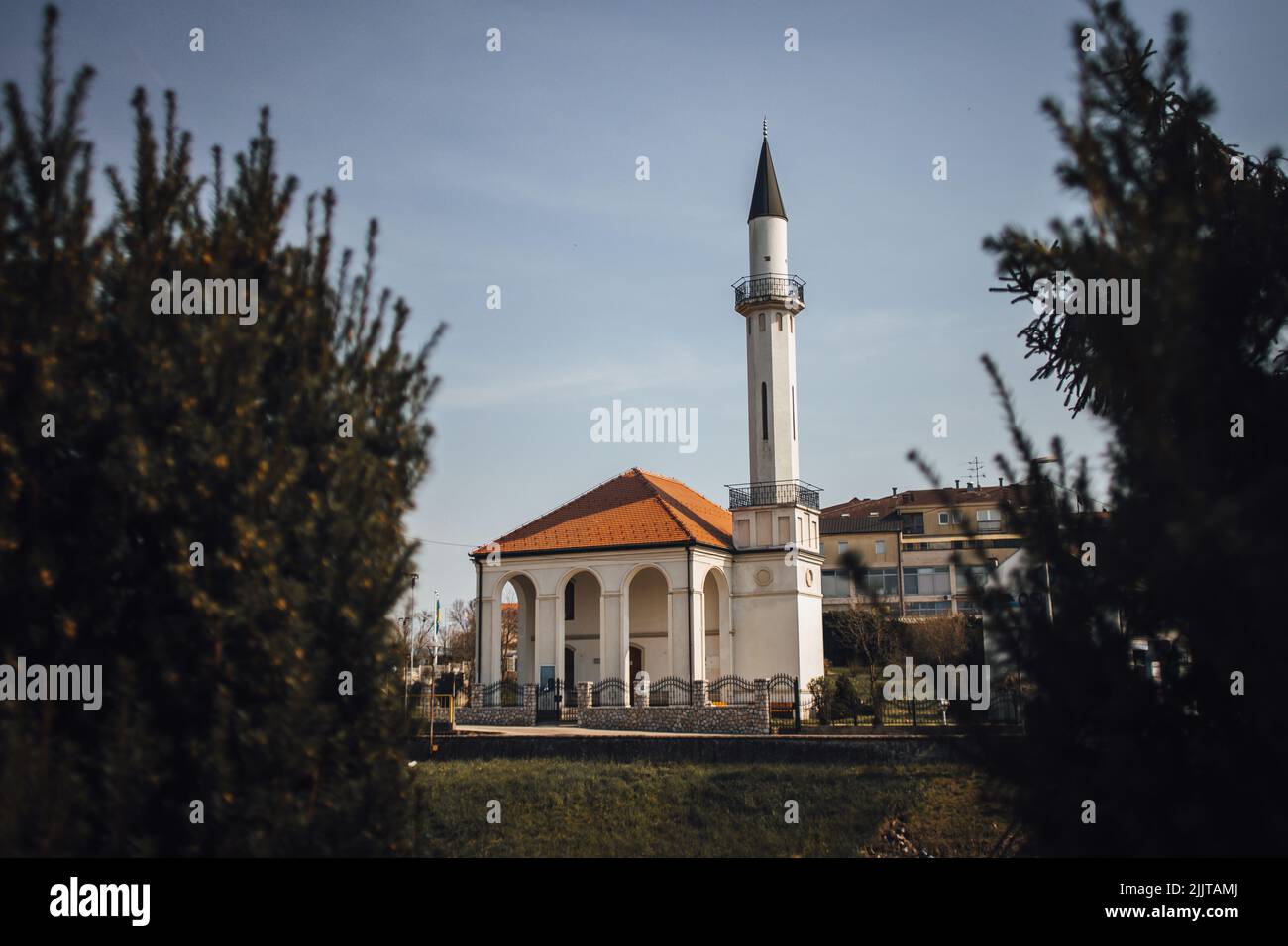 The exterior design of Atik mosque from behind trees on cost of Sava ...