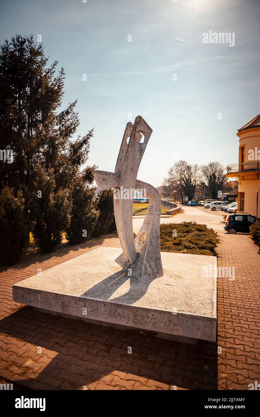 A vertical shot of a beautiful Monument sculpture to Hasan Aganovic in ...