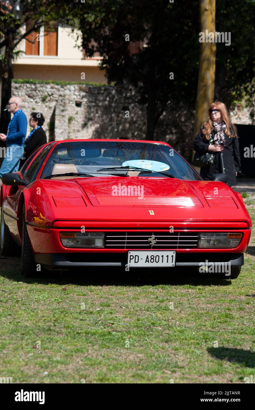 A vertical shot of a retro red Ferrari on display at a car show Stock ...