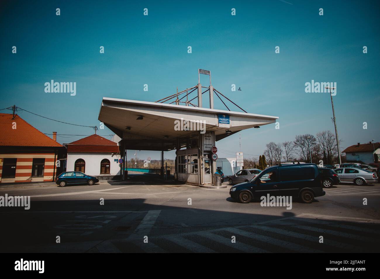 The cars and buildings during Border crossing - Brcko, Bosnia and ...