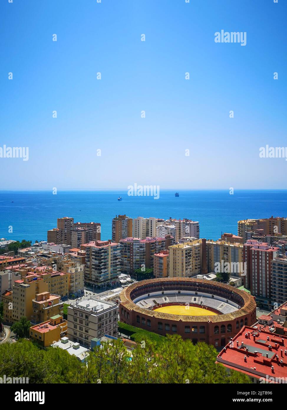 A vertical shot of the Bullring fight arena surrounded by buildings by ...