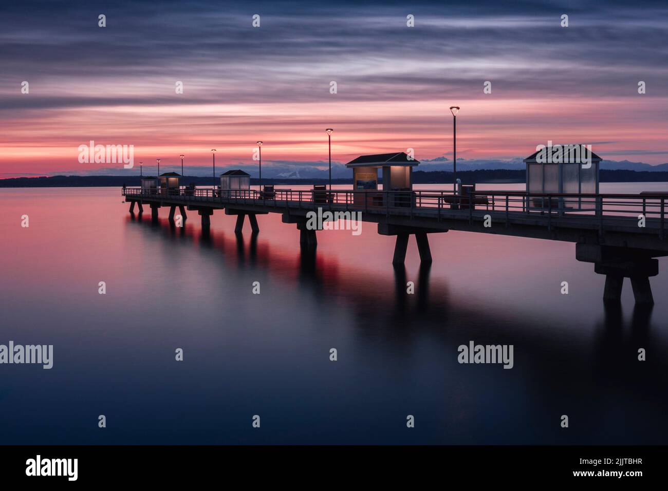A mesmerizing scene of the sunset on the empty bridge in Edmonds ...