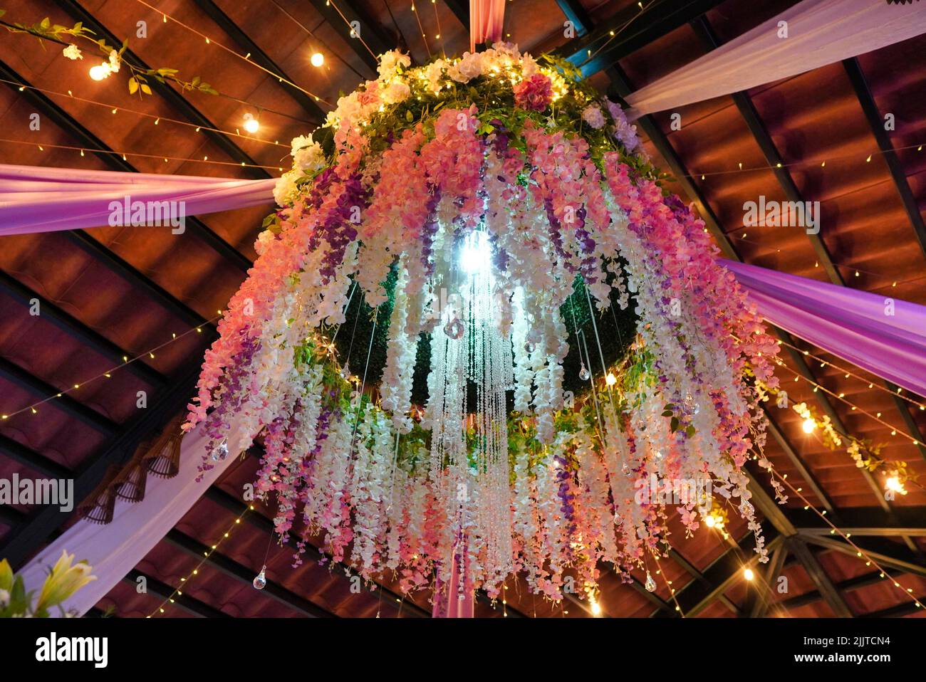 A crystal light fixture at a wedding reception Stock Photo - Alamy
