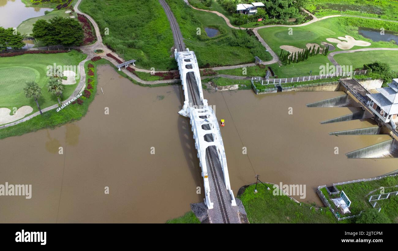 Aerial view of Tha Chomphu White Bridge, Lamphun, Thailand with river ...
