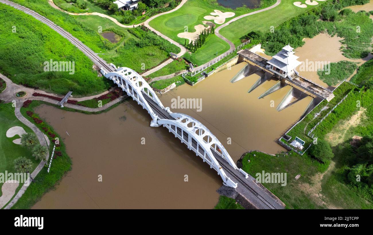 Aerial view of Tha Chomphu White Bridge, Lamphun, Thailand with river ...