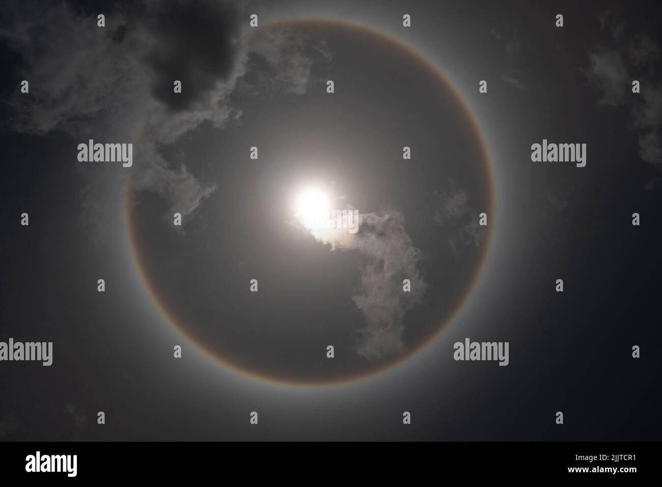 The beauty of the sun with a circular rainbow surrounded by bright ...