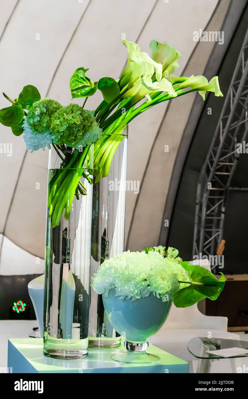 Luxury elegant flower pots on a table for an event party or wedding ...