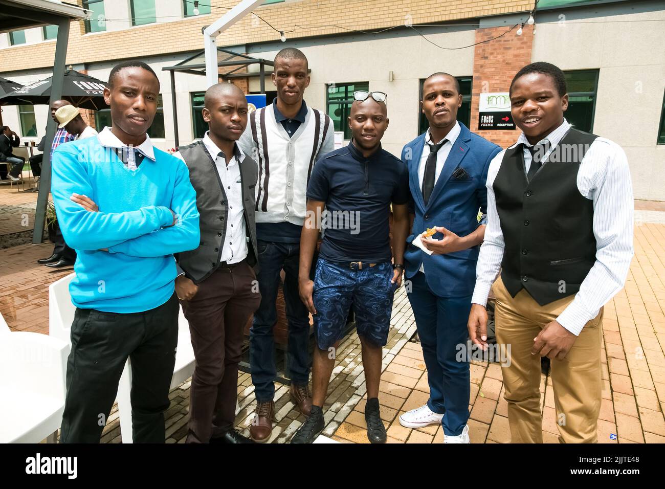 A group of young African students socialising on campus in Johannesburg ...