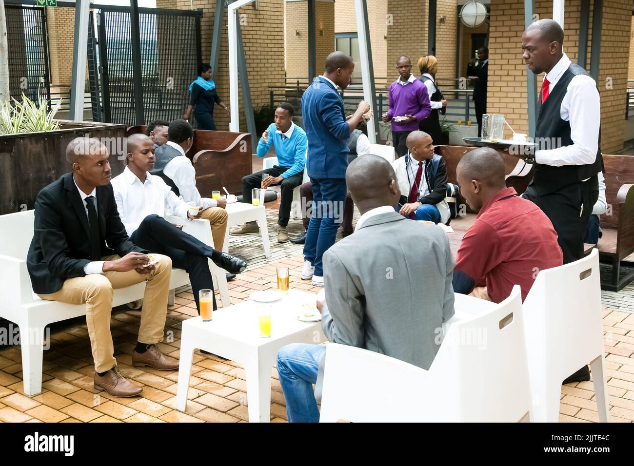 A group of young African students socialising on campus in Johannesburg ...