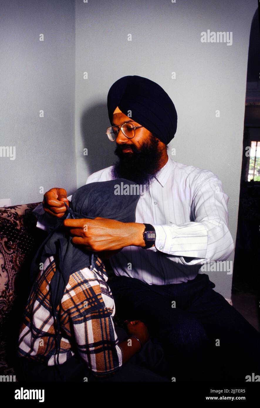 Sikh Father Tying his 7 year Old Son Patka Turban Southall London ...