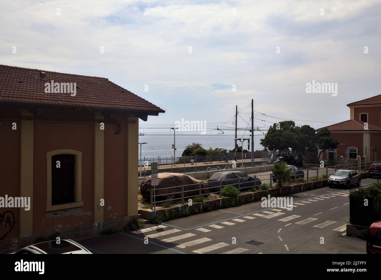 Railroad track next to a station by the sea Stock Photo - Alamy