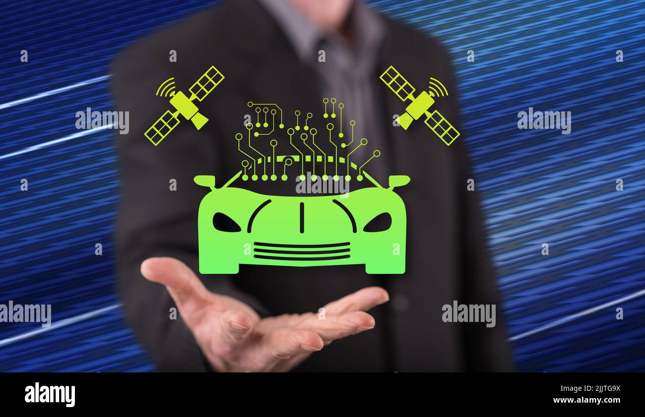 Autonomous car concept above the hand of a man in background Stock ...